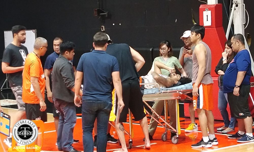 Trevis Jackson goes down with apparent back injury in Meralco practice